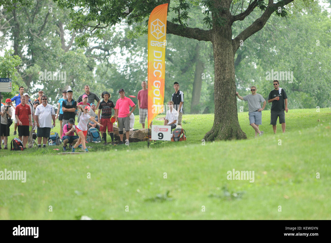 Disc Golf drive down the fairway with spectators Stock Photo - Alamy