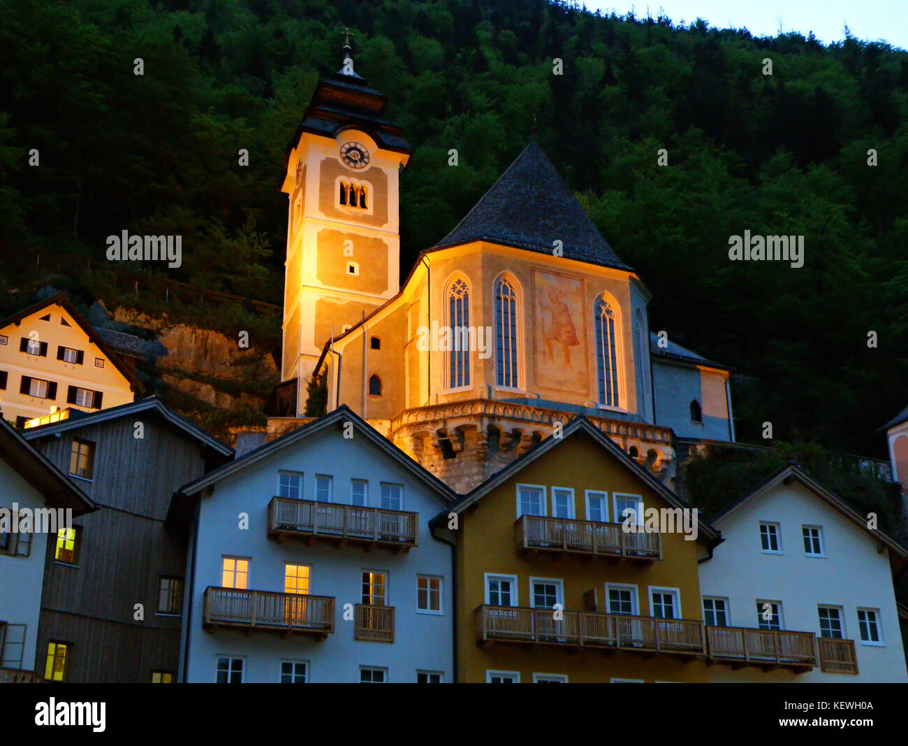 Beautiful church and traditional houses on the hillside at the dusk of ...