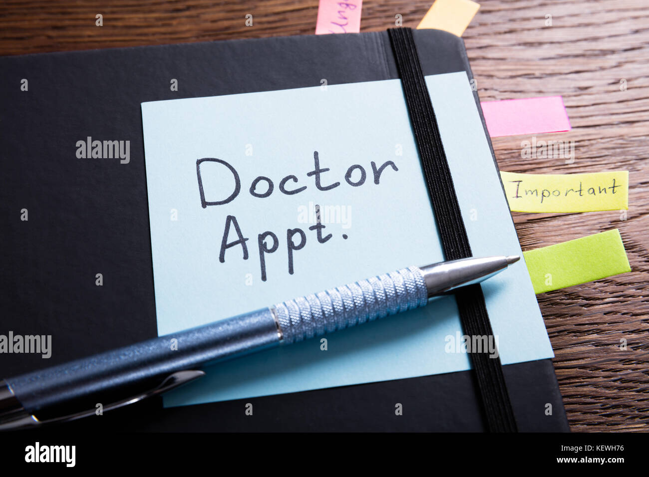 High Angle View Of A Diary Of Doctor Appointment With Sticky Note On ...