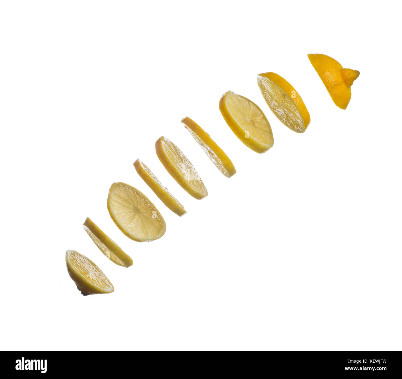 Falling slices of lemon isolated on white background Stock Photo - Alamy