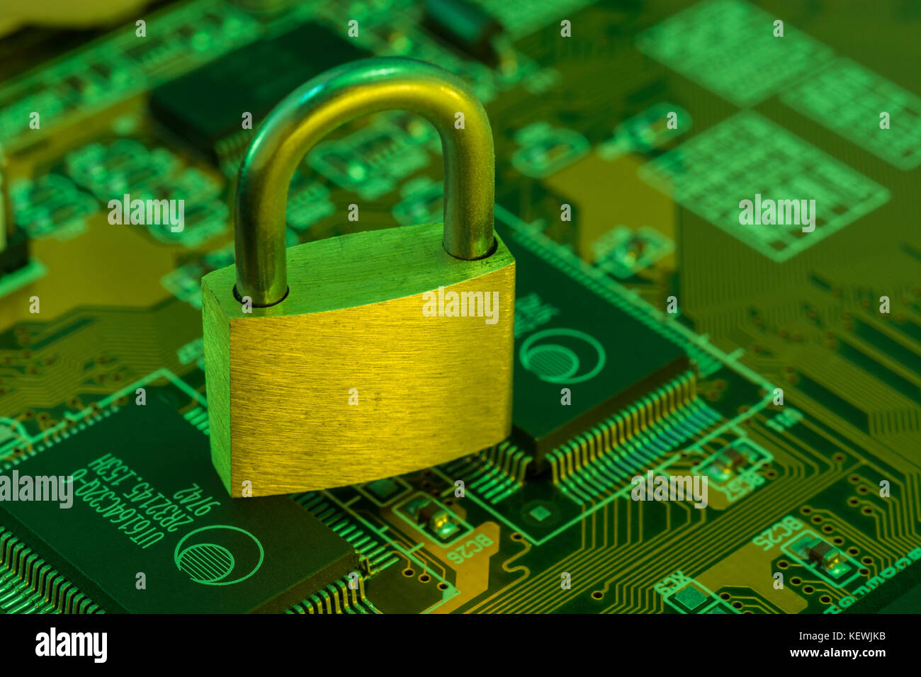 Close-up of small padlock on an electronic circuit board. For cyber ...