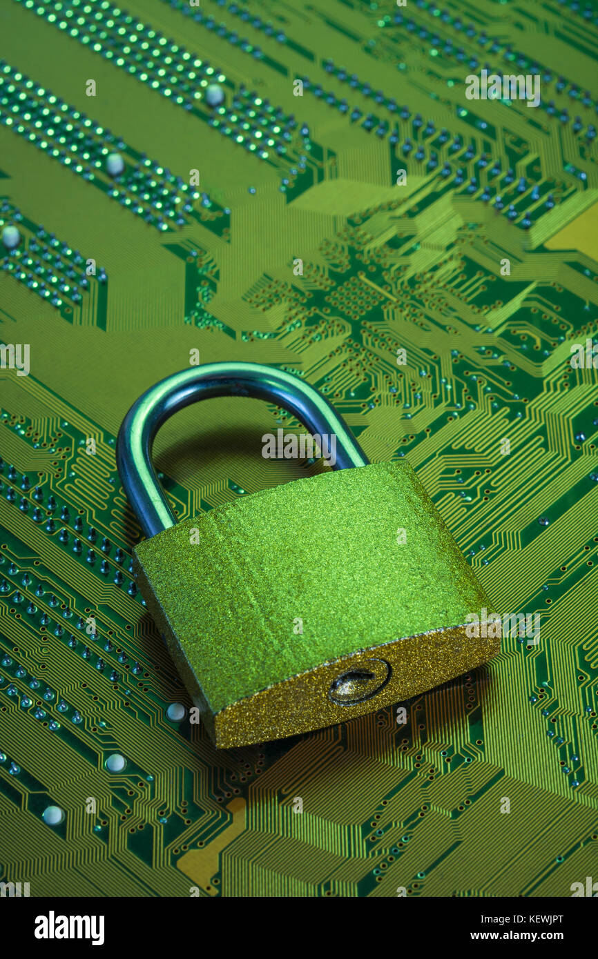 Close-up of small padlock on an electronic circuitboard. For cyber ...