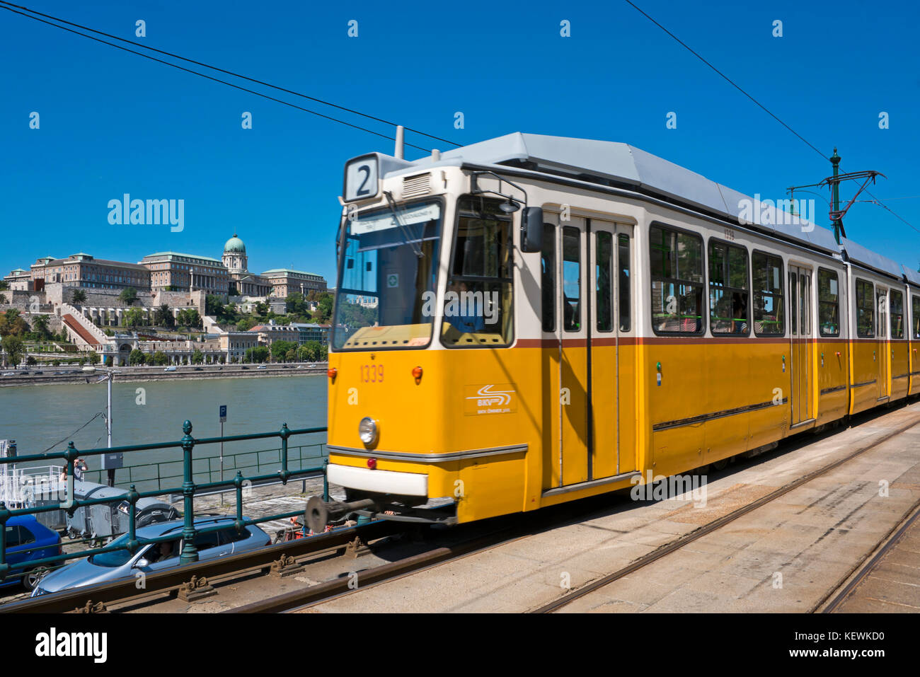 Horizontal view of a bright yellow tram in Budapest Stock Photo - Alamy