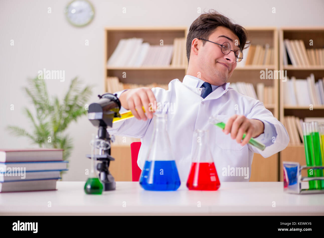 Mad crazy scientist doctor doing experiments in a laboratory Stock ...