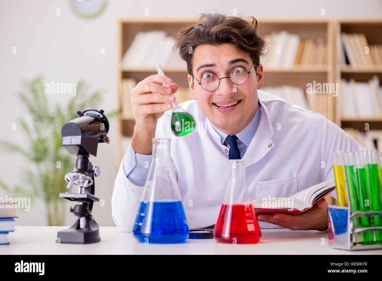Mad crazy scientist doctor doing experiments in a laboratory Stock ...