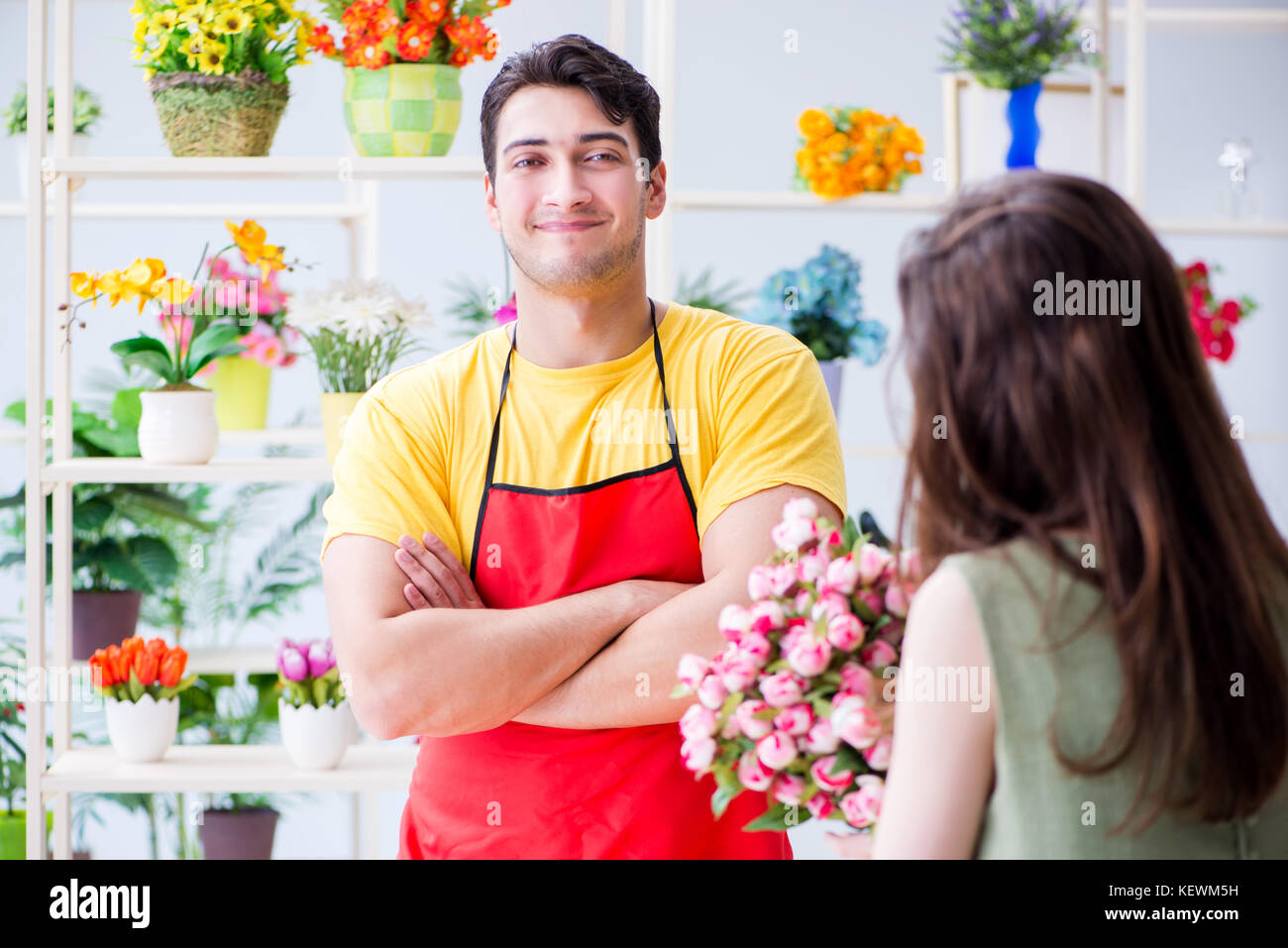 Florist selling flowers in a flower shop Stock Photo - Alamy