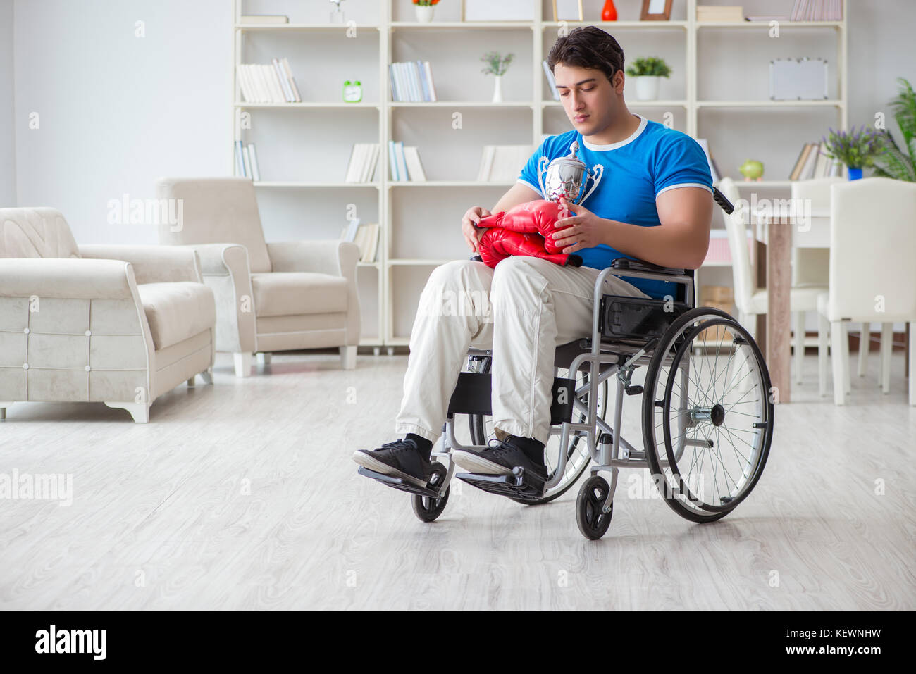 Disabled boxer at wheelchair recovering from injury Stock Photo - Alamy