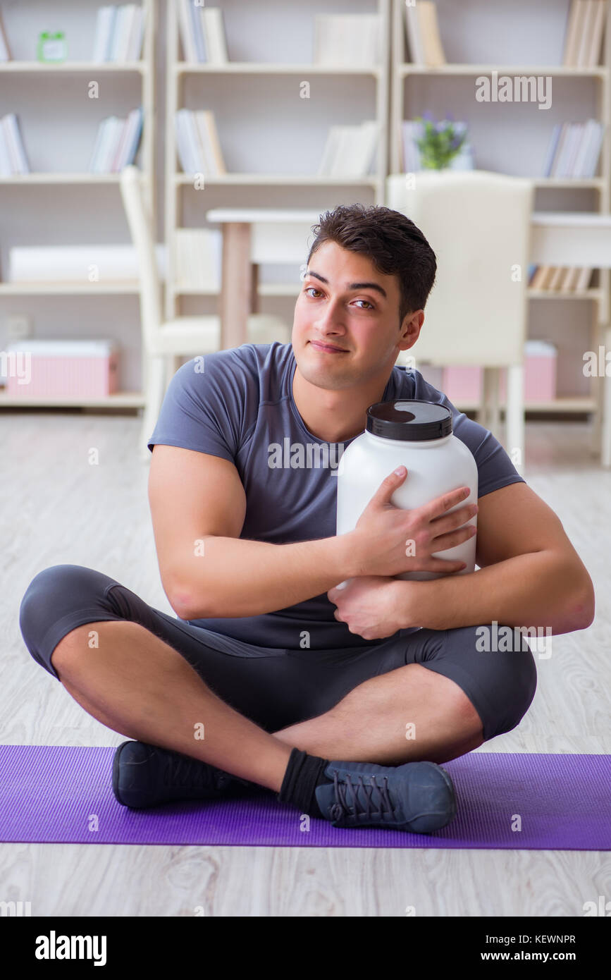 Man with food supplements in sports and healthy lifestyle concept Stock ...