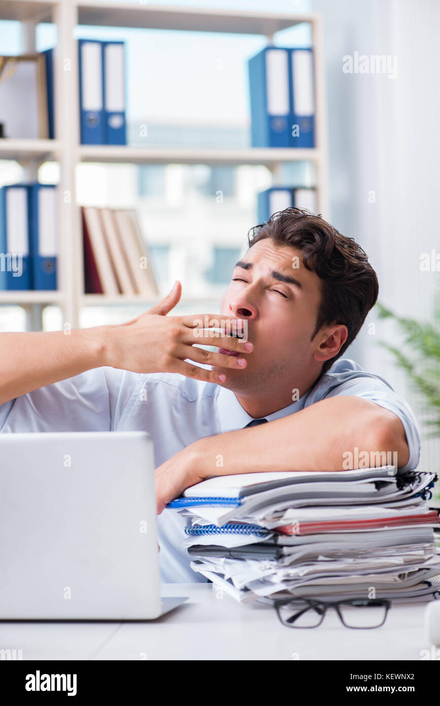 Tired exhausted businessman sitting in the office Stock Photo - Alamy