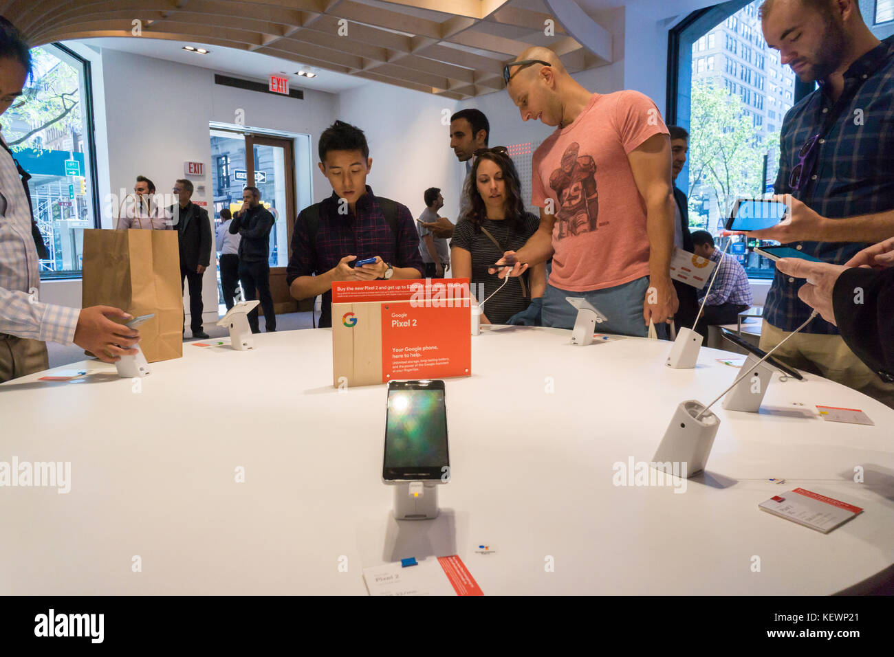 Visitors try out the new Pixel 2 smartphones in the Google store in the ...