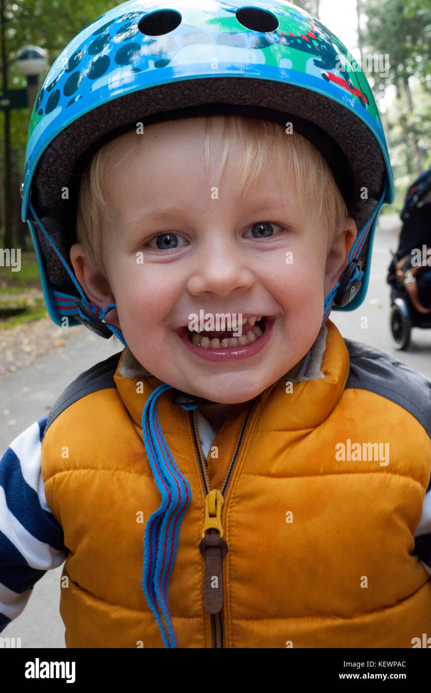Little boy riding a bike down a forest path Stock Photo - Alamy