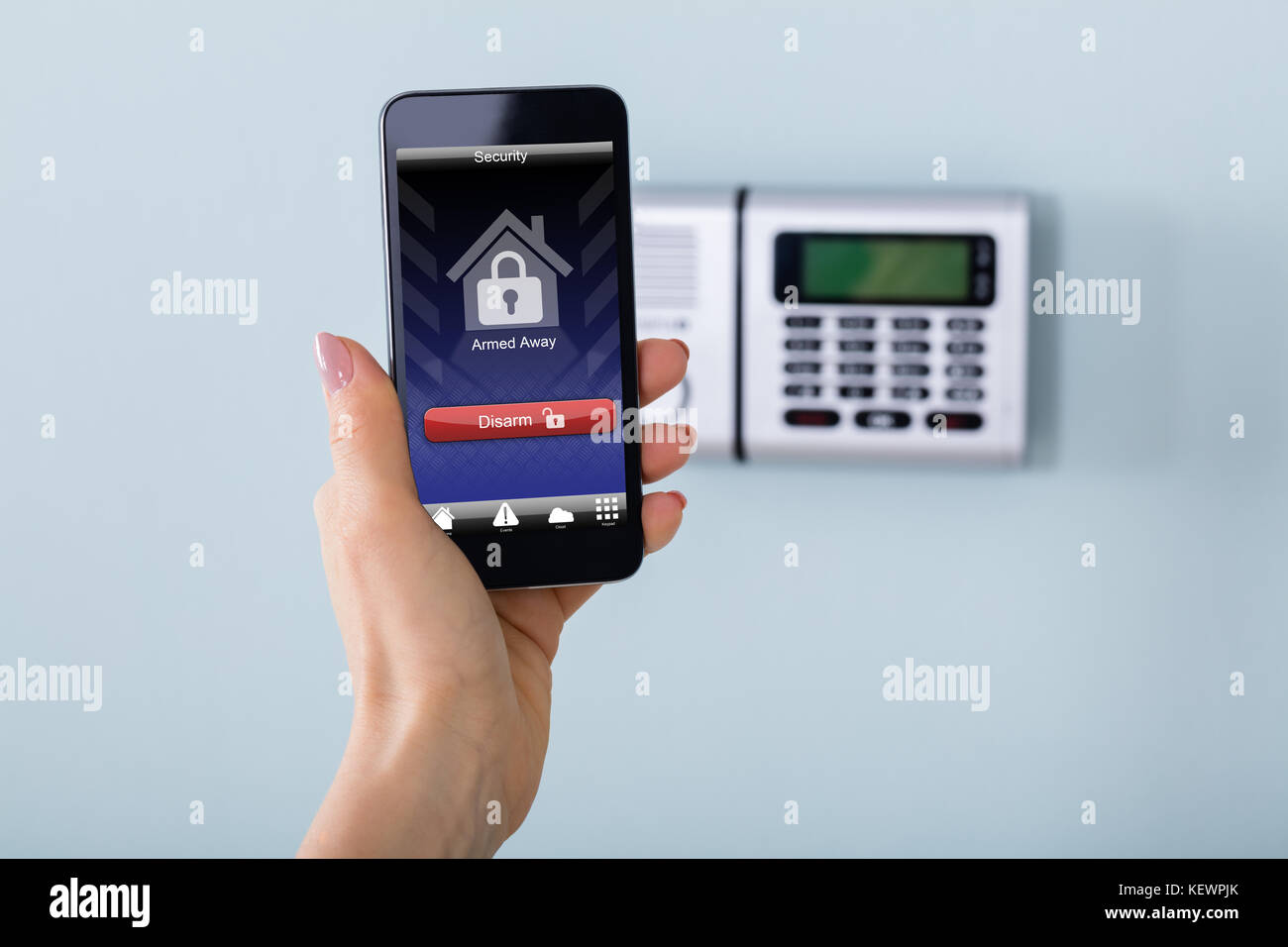 Security Alarm Keypad With Person Disarming The System With Remote ...