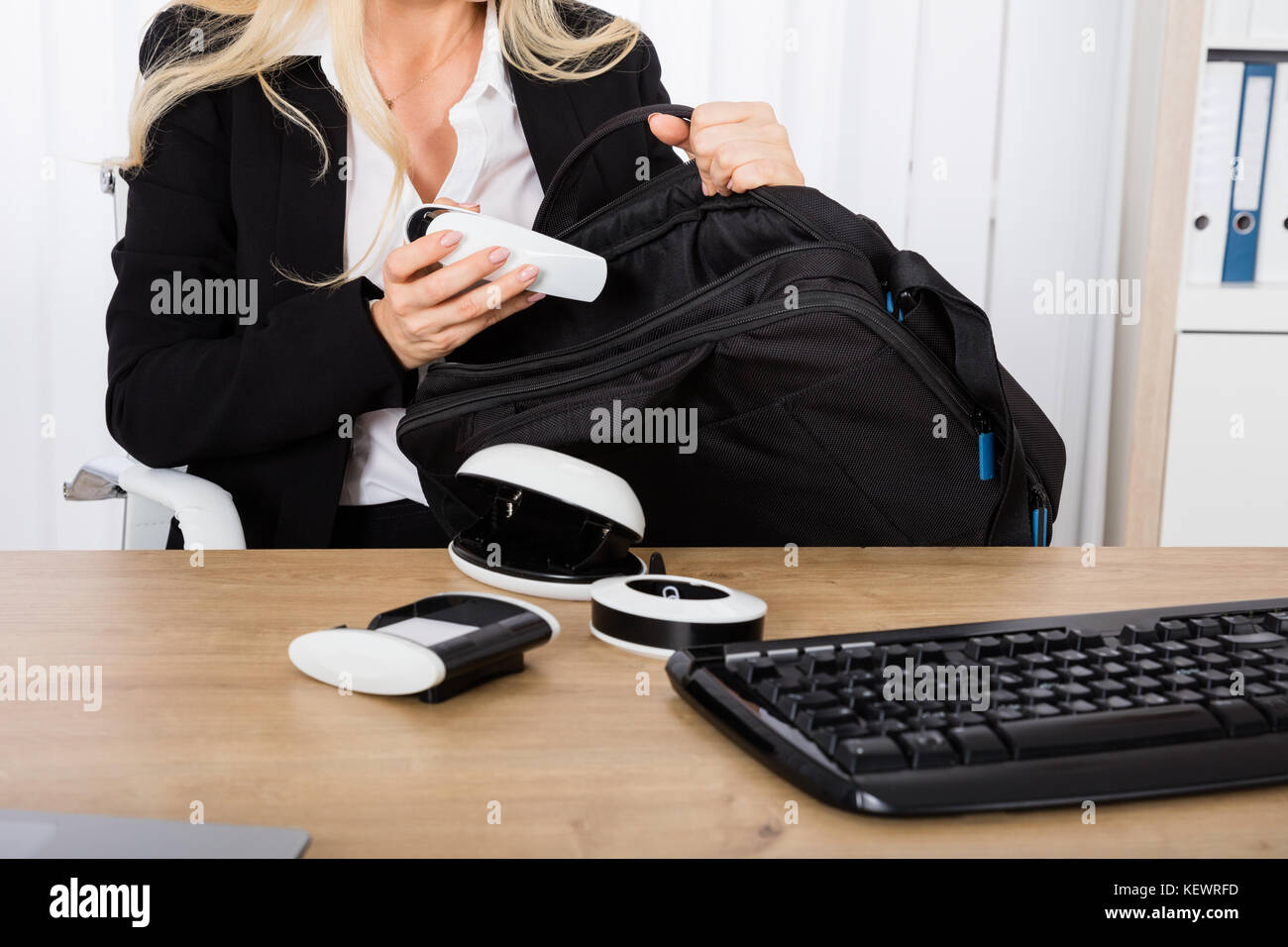 Close-up Of A Businesswoman Stealing A Stapler At Office Desk Stock ...