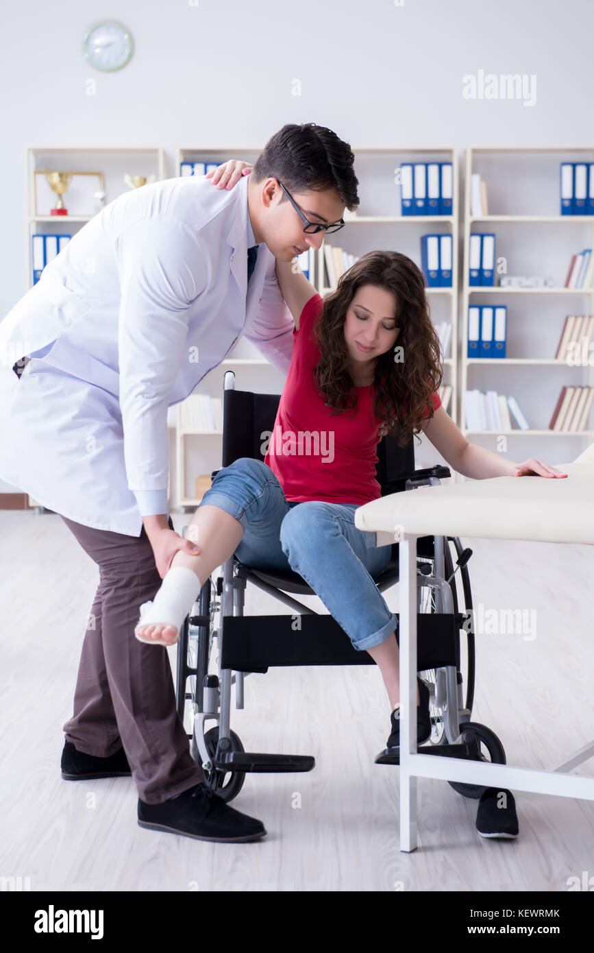 Doctor and patient during check-up for injury in hospital Stock Photo ...