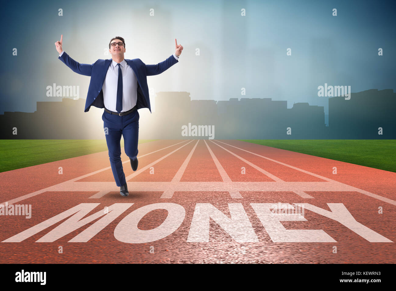 Businessman running towards money on track Stock Photo - Alamy