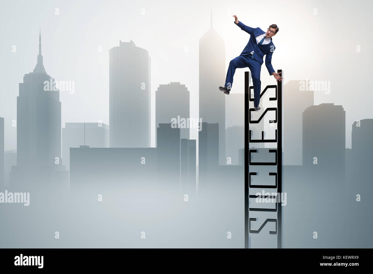Businessman slipping from the top of ladder Stock Photo - Alamy