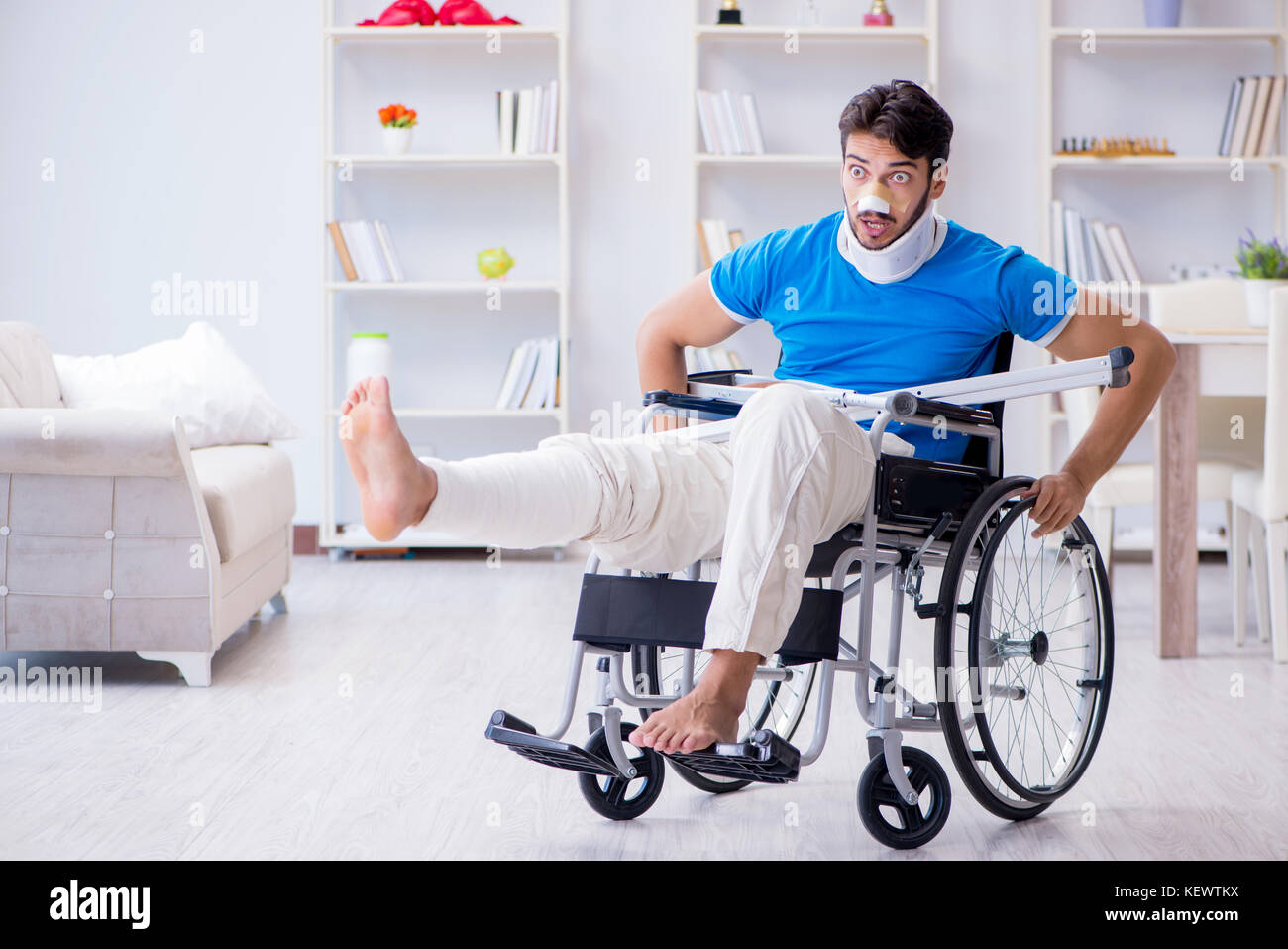 Injured young man recovering at home Stock Photo - Alamy
