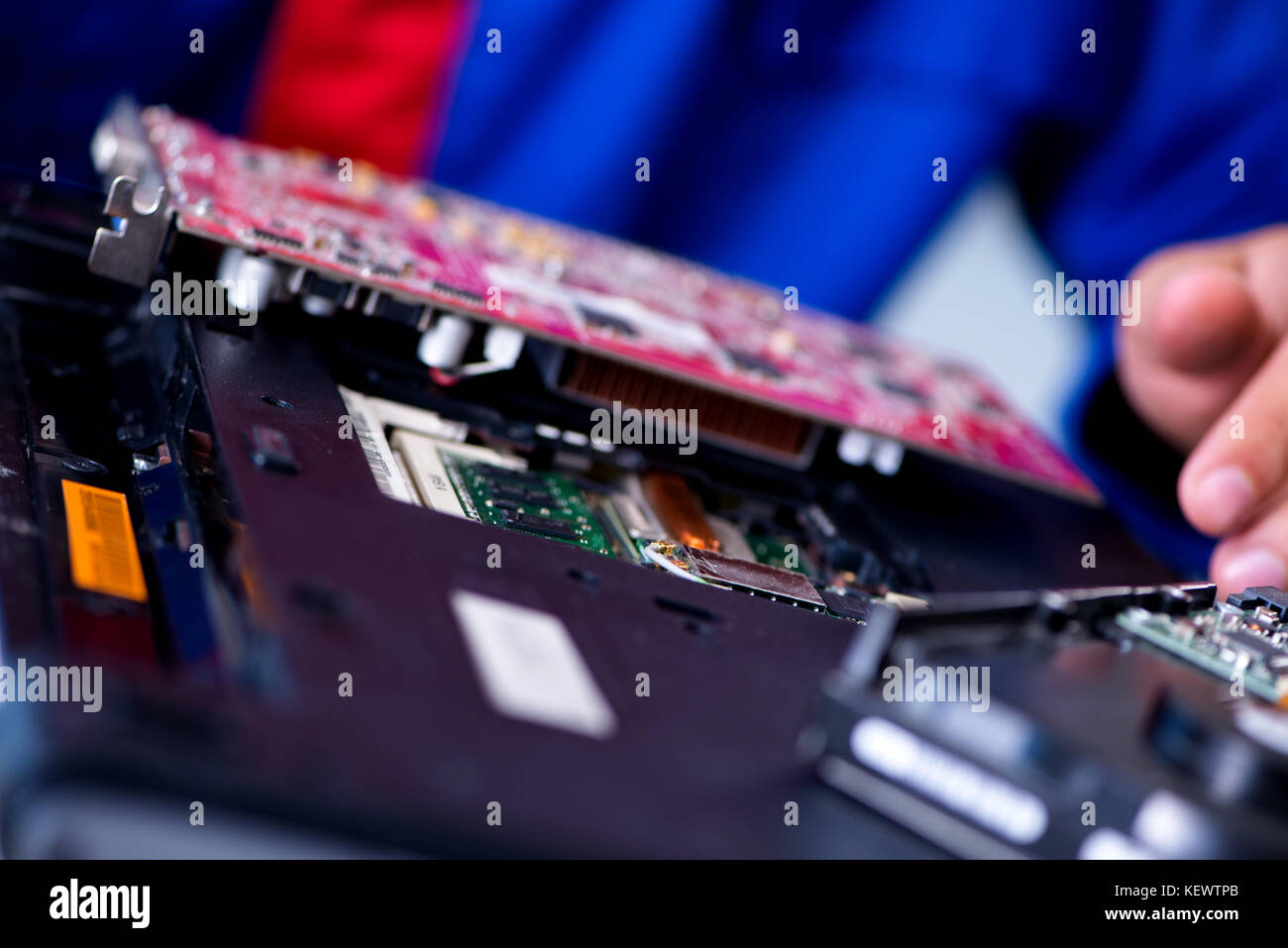 Repairman working in technical support fixing computer laptop ...