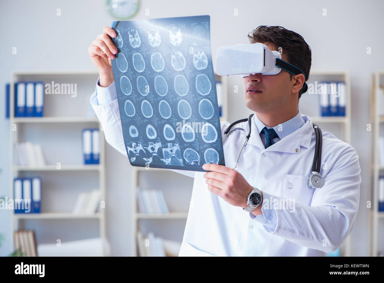 Young doctor looking at MRI scan through VR glasses Stock Photo - Alamy