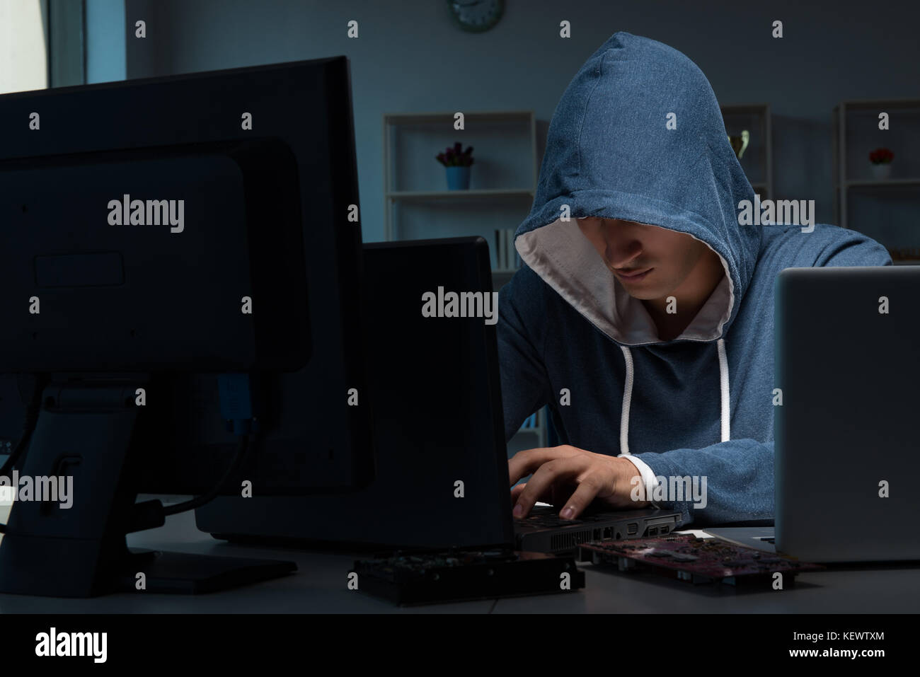Hacker hacking computer at night Stock Photo - Alamy