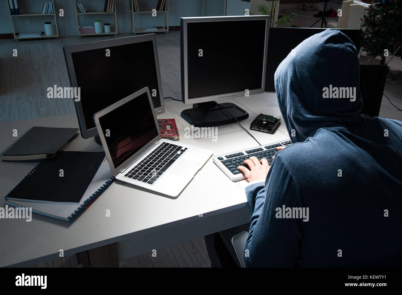 Hacker hacking computer at night Stock Photo - Alamy