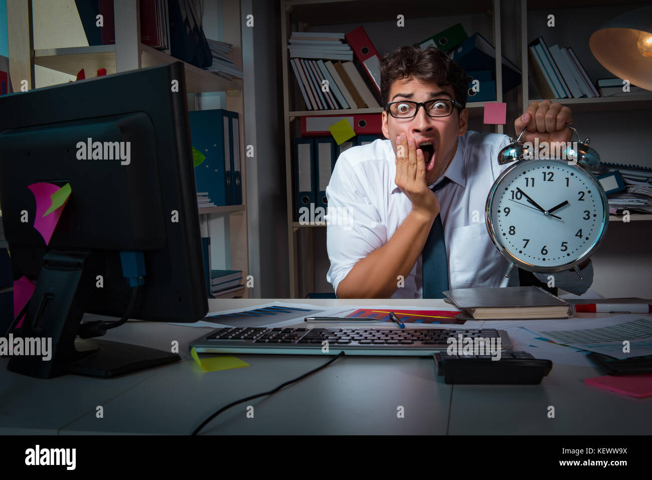 Man businessman working late hours in the office Stock Photo - Alamy