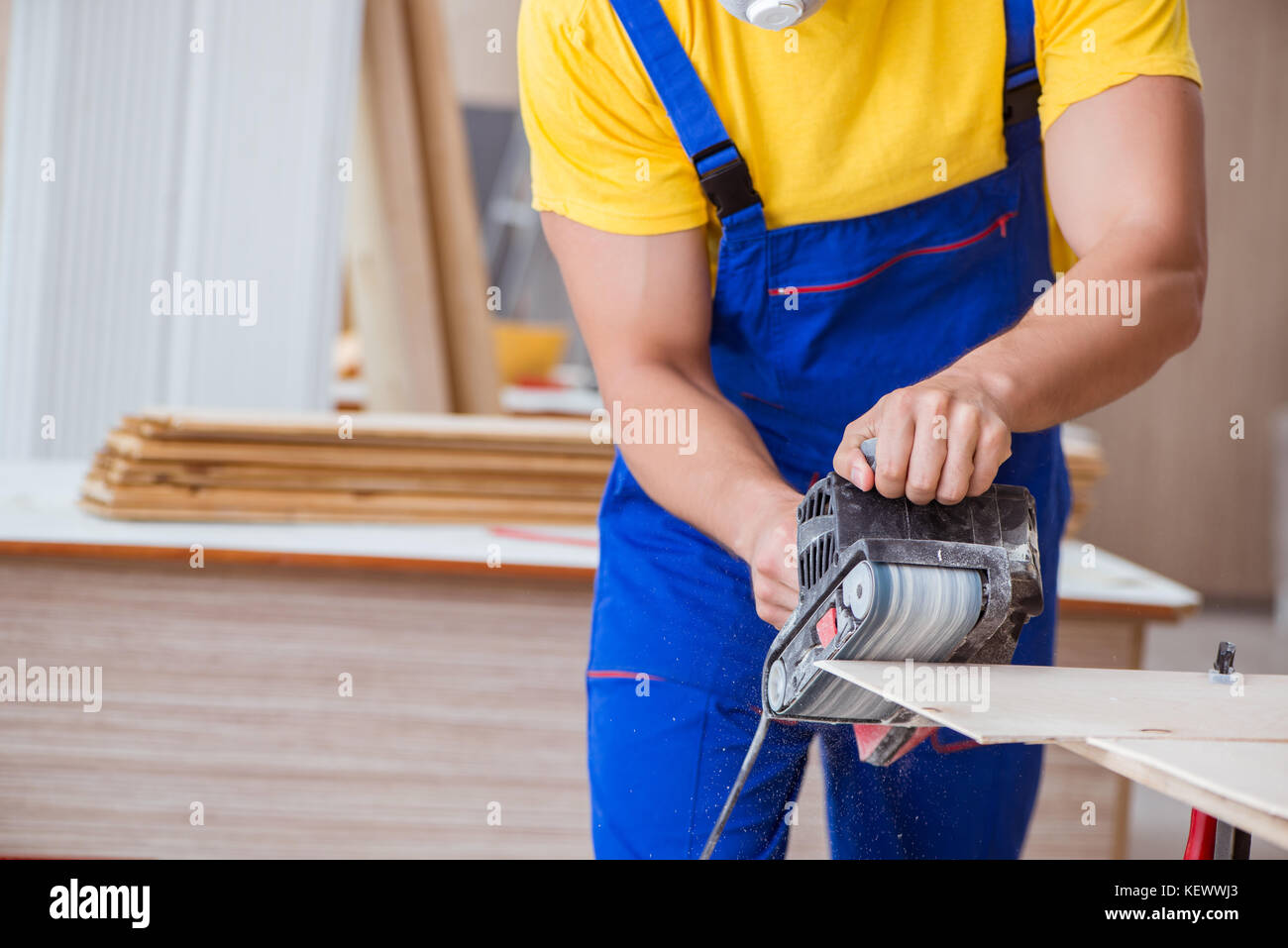 Carpenter working in the workshop Stock Photo - Alamy