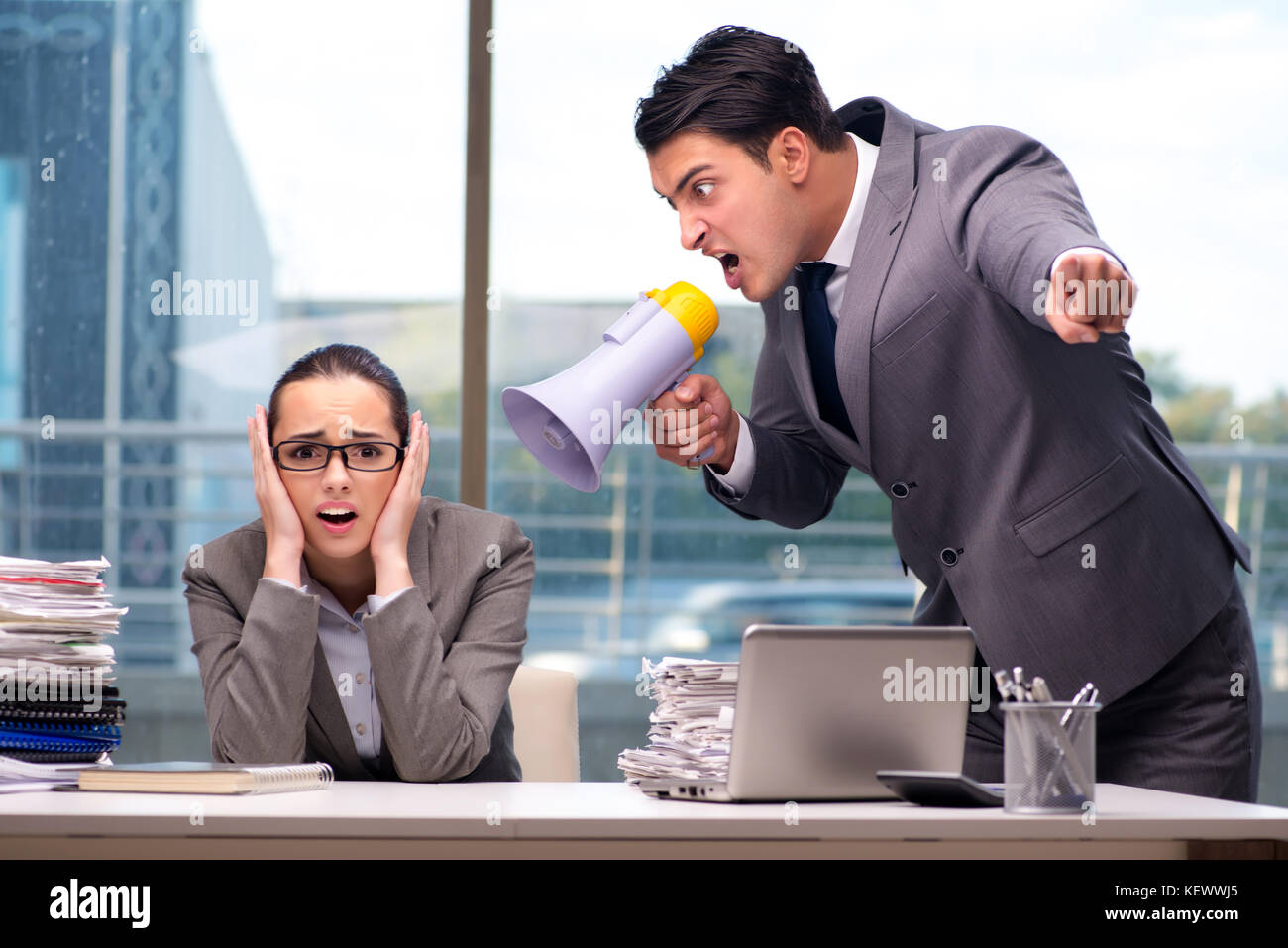 Boss yelling at his team member Stock Photo - Alamy