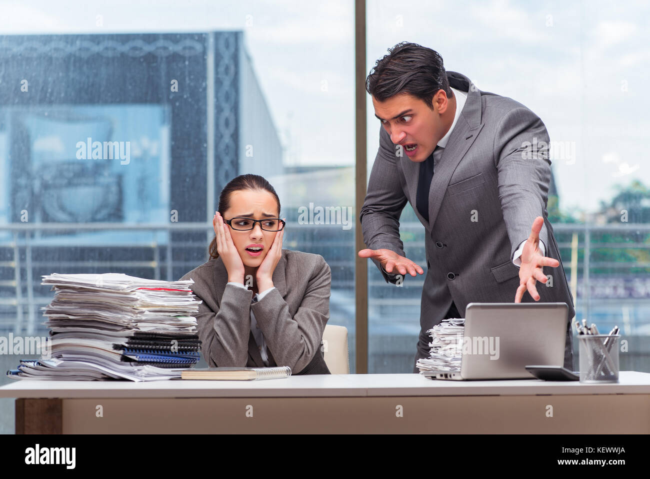 Boss yelling at his team member Stock Photo - Alamy