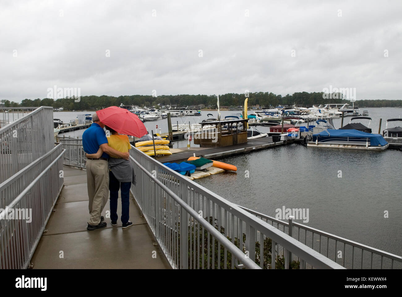 Lake Murray Boat Club and Marina, Irmo, S.C. USA. Couple has arms ...