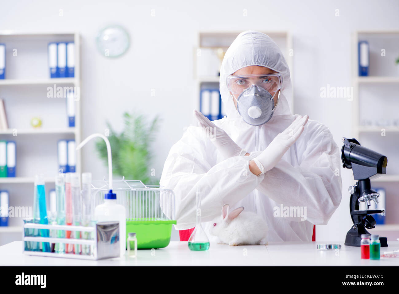 Scientist doing animal experiment in lab with rabbit Stock Photo - Alamy