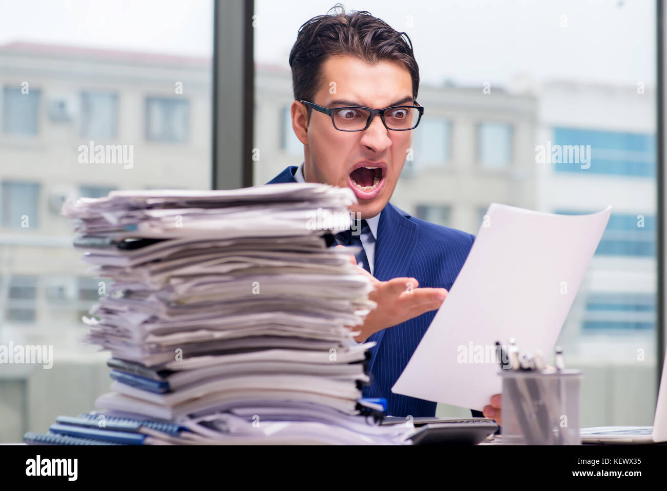 Workaholic businessman overworked with too much work in office Stock ...