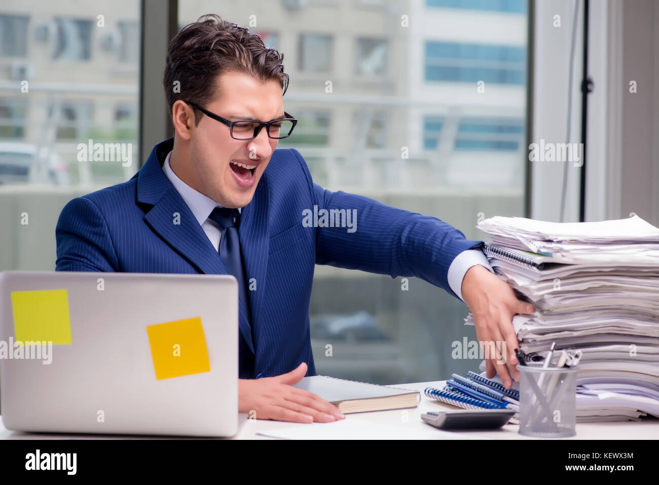 Workaholic businessman overworked with too much work in office Stock ...