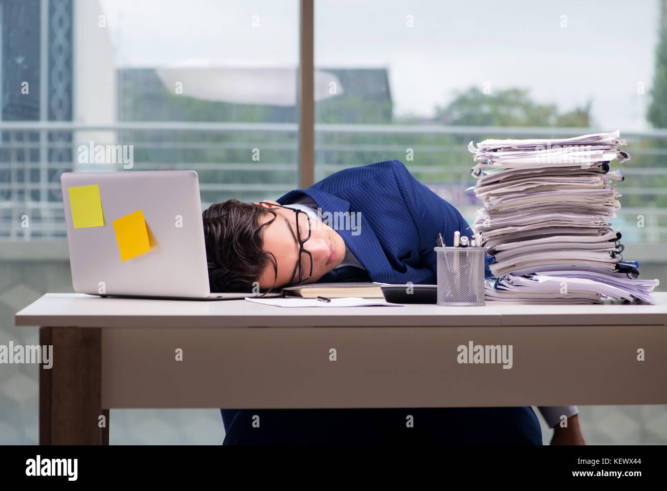 Workaholic businessman overworked with too much work in office Stock ...
