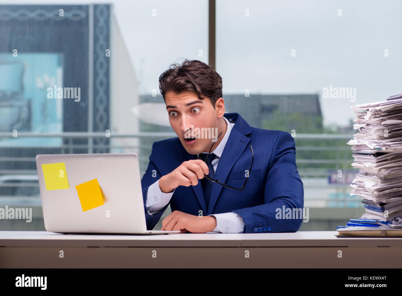 Workaholic businessman overworked with too much work in office Stock ...