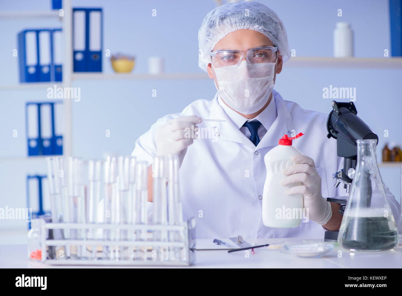 Man in the lab testing new cleaning solution detergent Stock Photo - Alamy