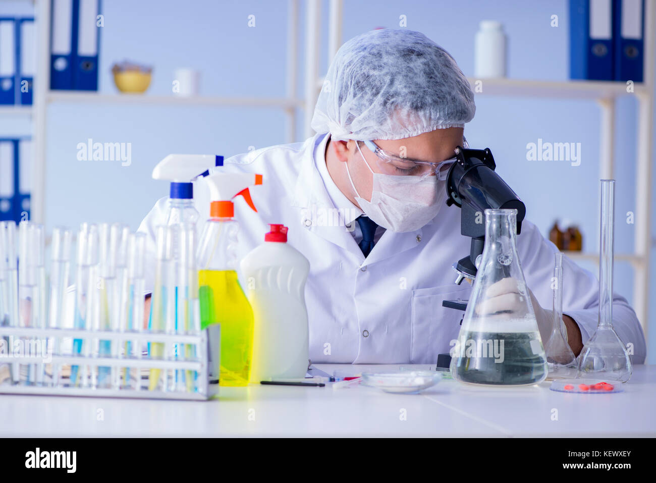 Man in the lab testing new cleaning solution detergent Stock Photo - Alamy