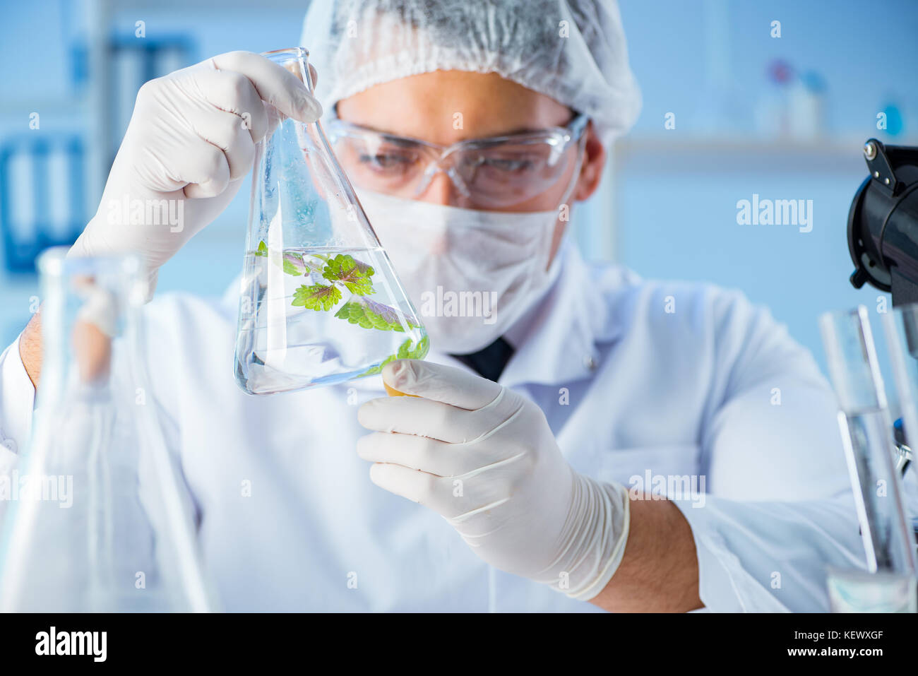 Biotechnology concept with scientist in lab Stock Photo - Alamy