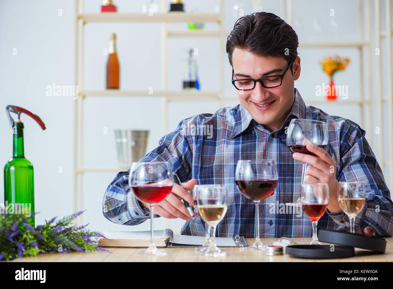 Professional sommelier tasting red wine Stock Photo - Alamy