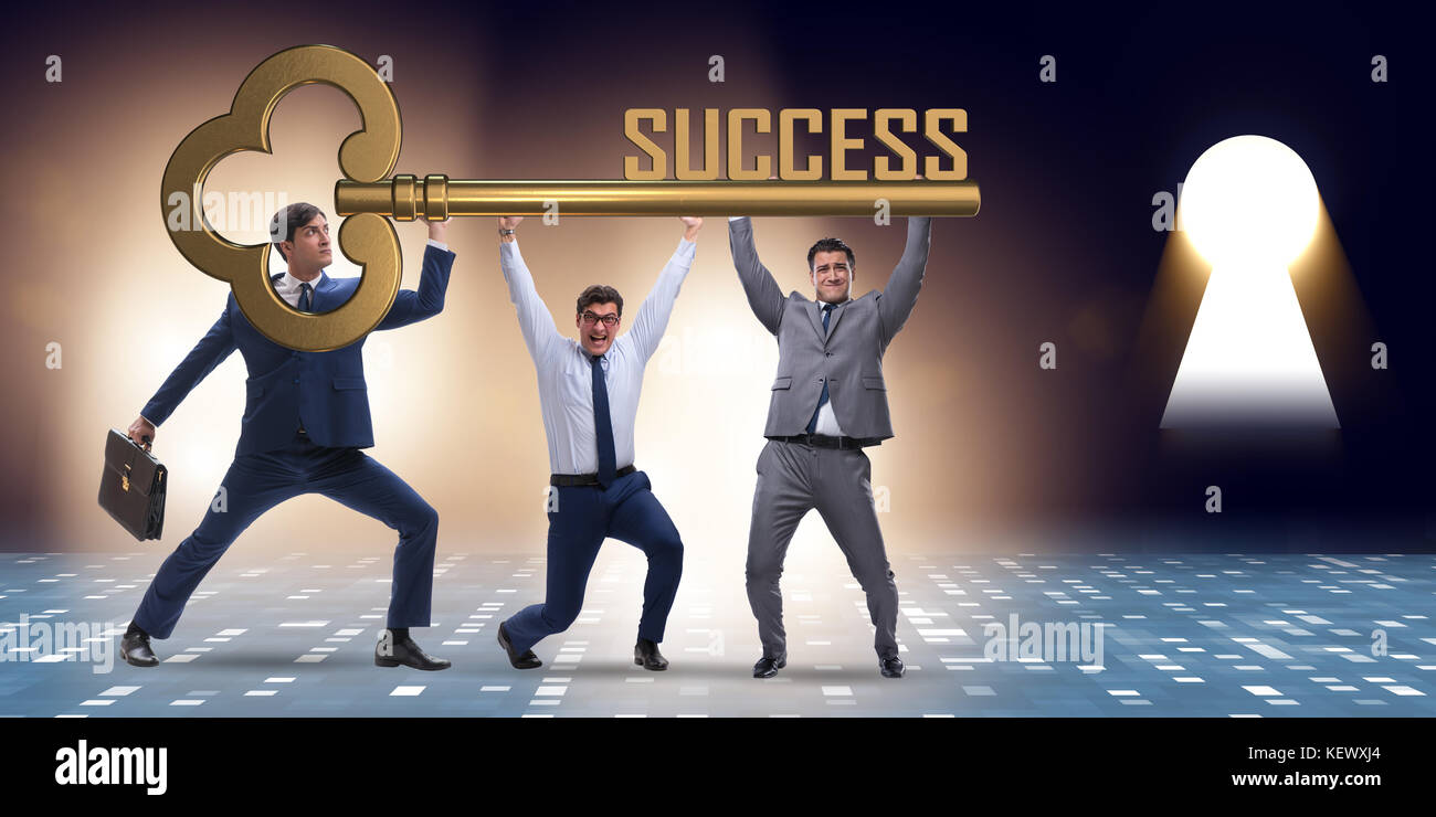 Businessmen holding giant key in business concept Stock Photo - Alamy