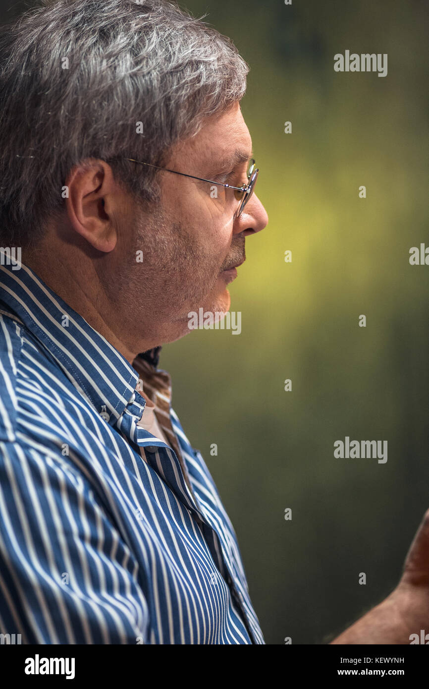 The mature creative engineer working with project on drawing board ...