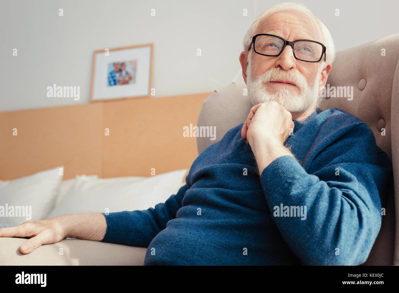 Thoughtful bearded male dreaming about future Stock Photo - Alamy