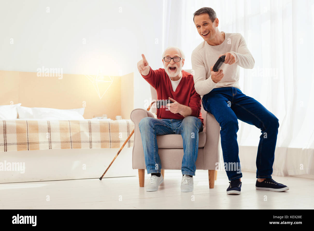Happy pensioner celebrating his win Stock Photo - Alamy