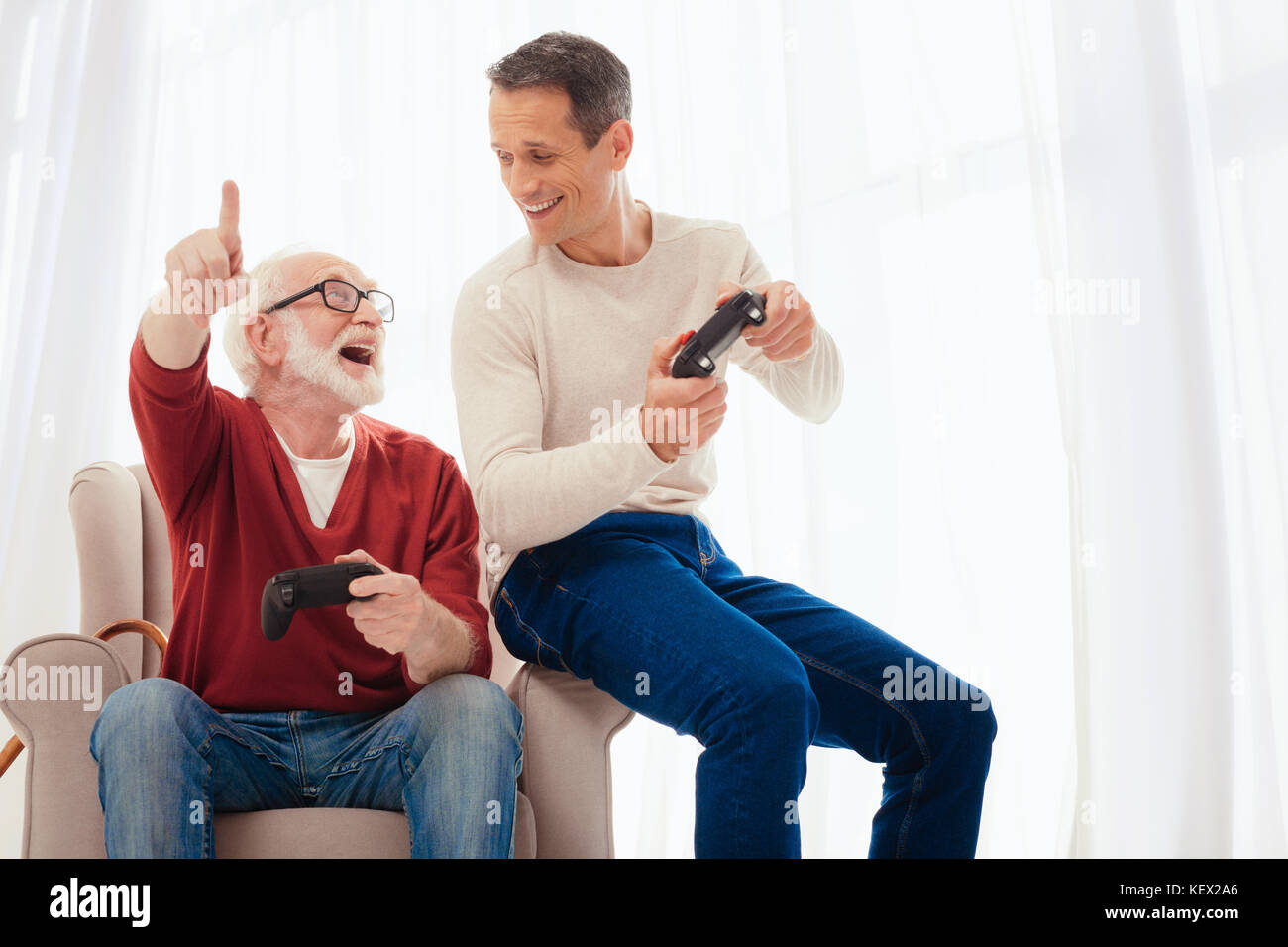Delighted male person expressing positivity Stock Photo - Alamy