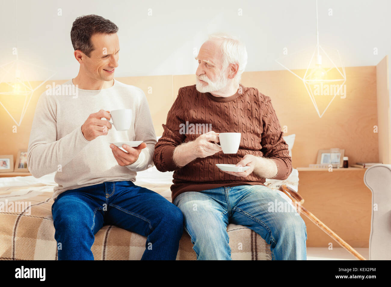 Positive relatives having coffee break Stock Photo - Alamy