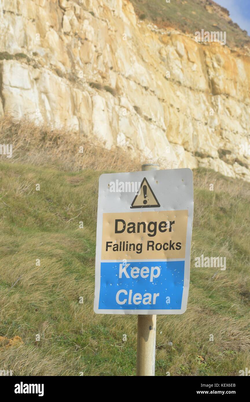 Danger falling rocks keep clear sign Stock Photo - Alamy