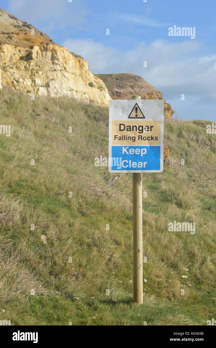 Danger falling rocks keep clear sign Stock Photo - Alamy