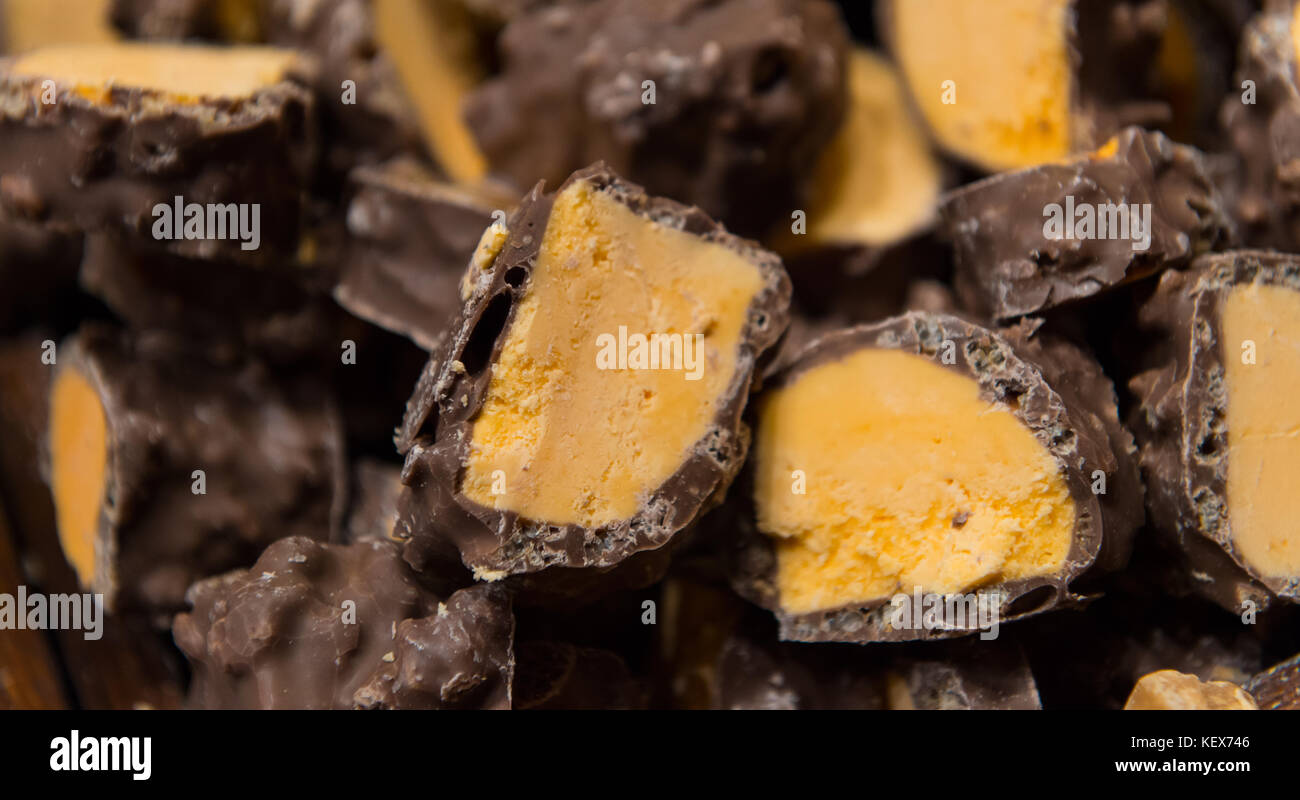 Delicious chunks of homemade orange and chocolate sweets on display in ...