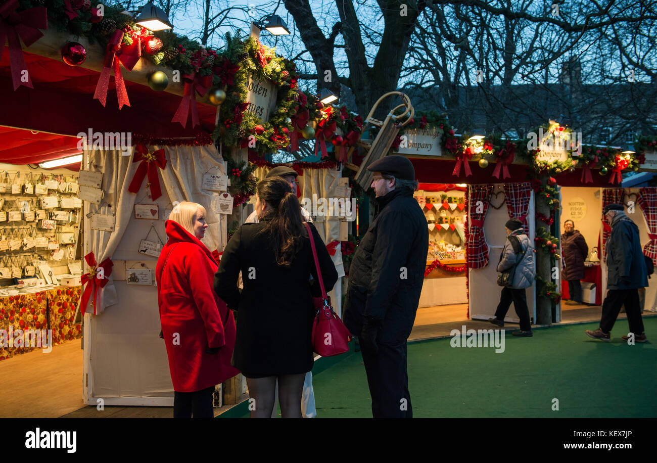 EDINBURGH, SCOTLAND, UK – December 08, 2014 - Friend talking at ...