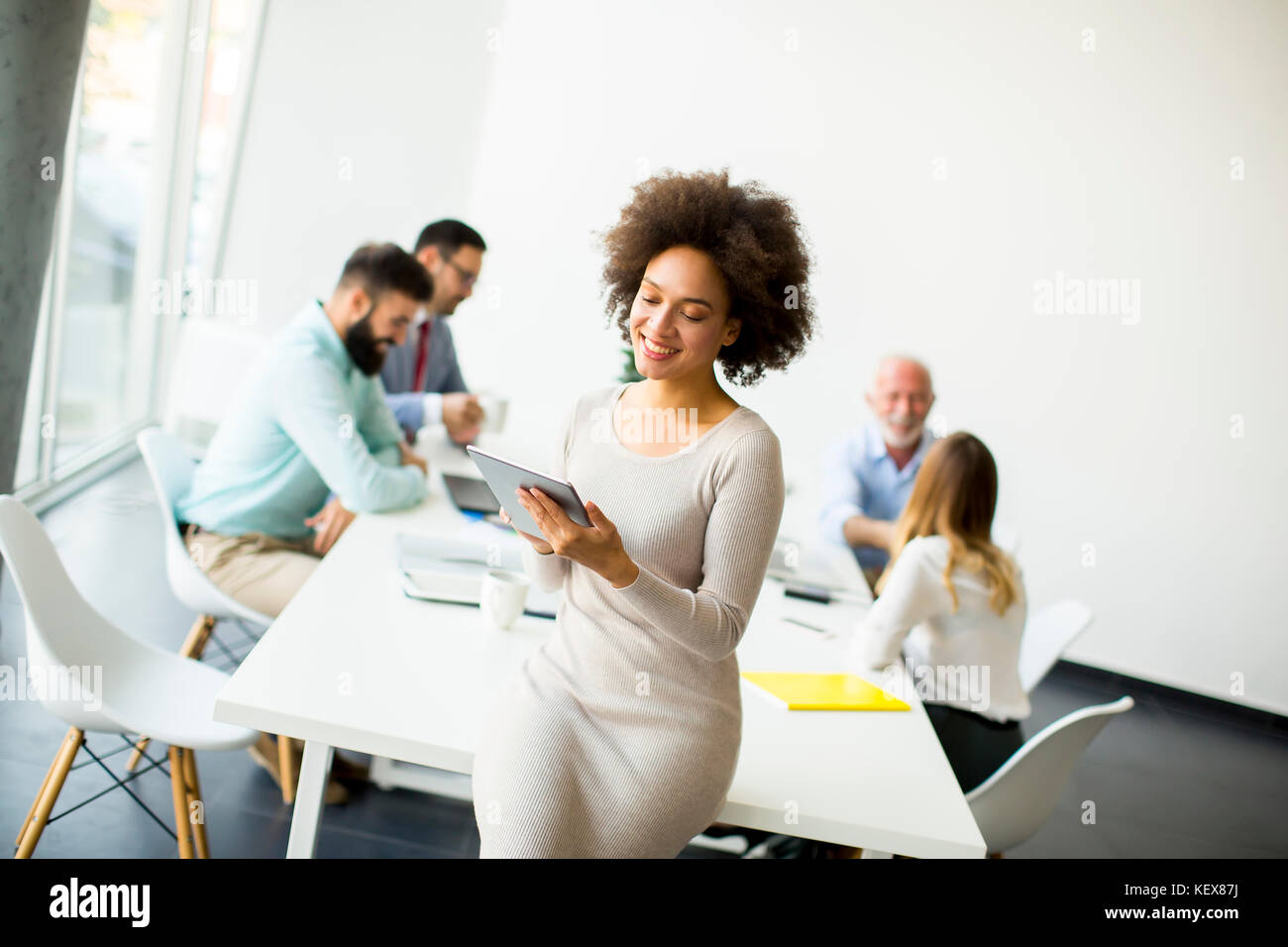 Typical business day at a modern company with multiethnic group of ...